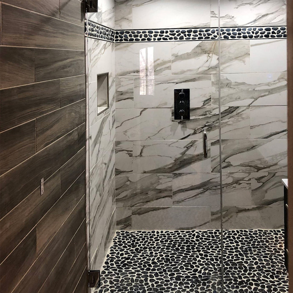 Say goodbye to slippery shower floors with Diflart pebble tile.